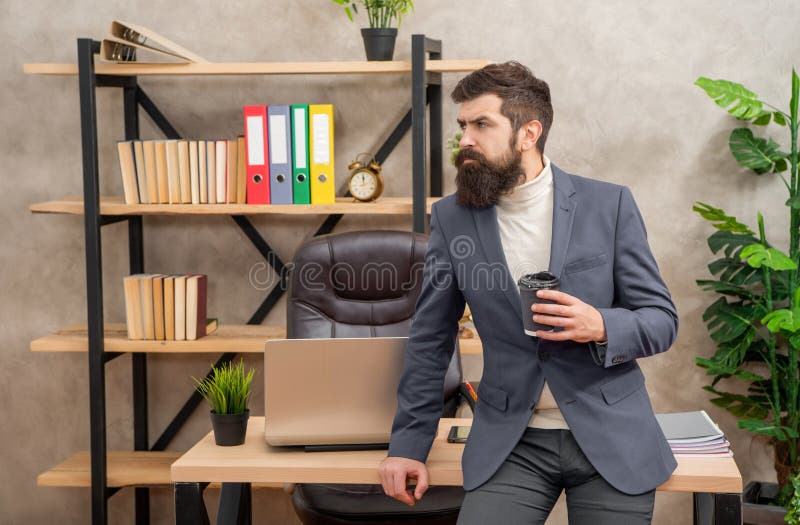 Short Break during the Working Day. Serious Imployee Hold Cup. Office ...