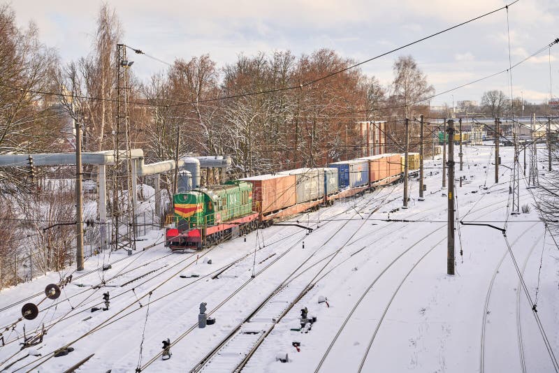 Short Freight Train on Snowy Railroad in Winter Time Editorial Image ...