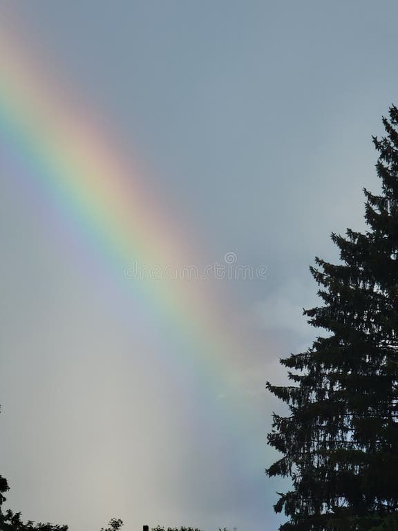 Short glimpse of a rainbow stock photo. Image of wind - 259876304
