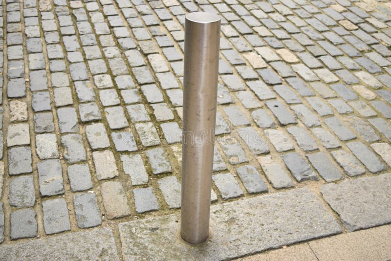 Short Metal Pole in the Middle of the Pavement Stock Photo - Image of ...