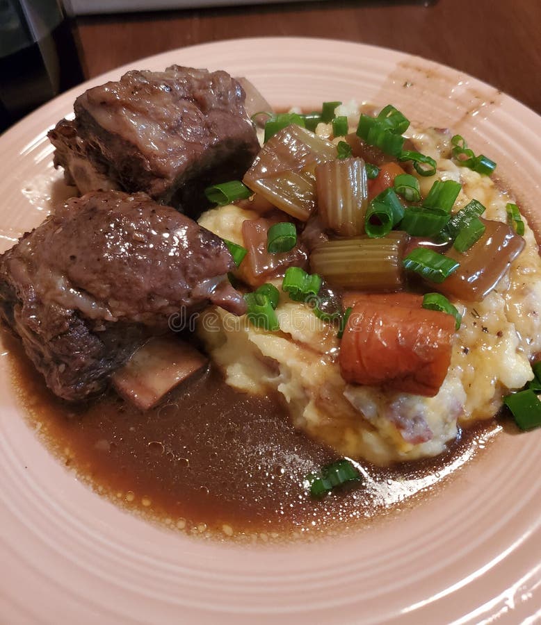 Short ribs with vegetables stock image. Image of ribs - 213685001