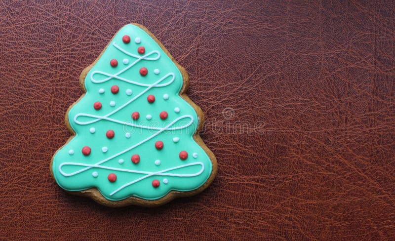 Shortbread Cookie in Pine Tree Shape with Colored Icing on a Leather ...