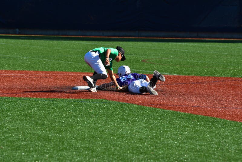 A Shortstop Tagging a Runner at Second Trying To Steal the Base ...