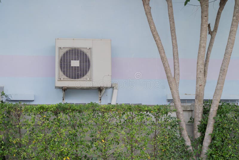 Shot of an Air Source Heat Pump, AC Unit Installed Outdoors at Home ...