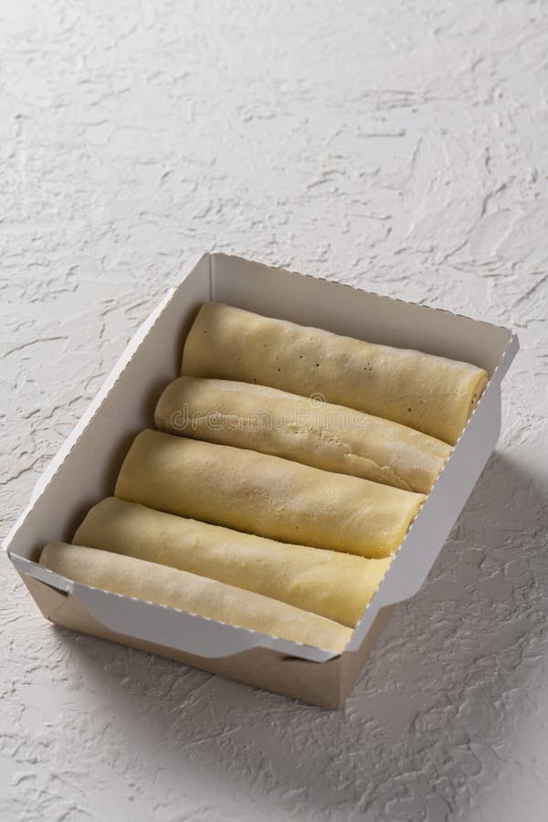 Shot of Box of Rolled Crepes on White Tabletop Stock Image - Image of ...