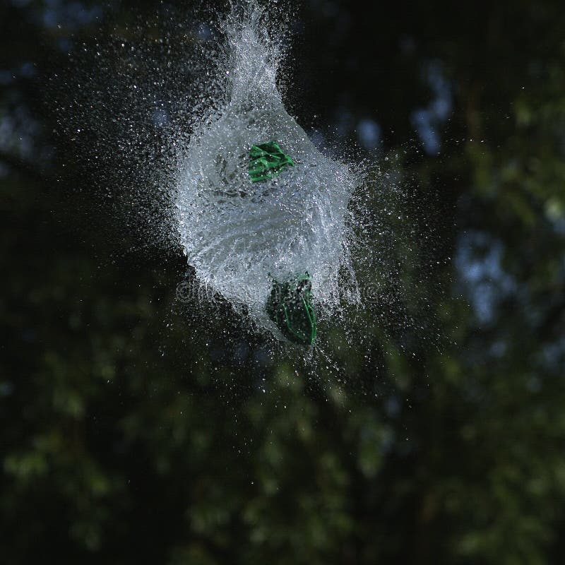 Shot Breaking Water Filled Green Balloon Stock Photo - Image of drop ...