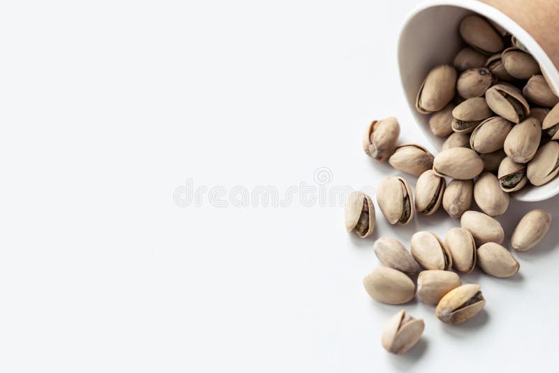 A Bunch of Pistachios Poured Out of the Little Pot. Copy Space Stock ...