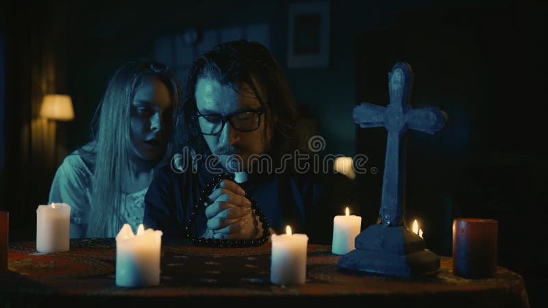 Shot Capturing a Table with Magical Tools on it. a Priest is Sitting at ...
