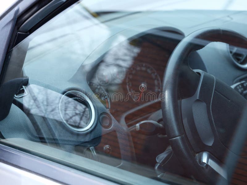 A Shot of a Car Dashboard and Steering Wheel through the Window Stock ...