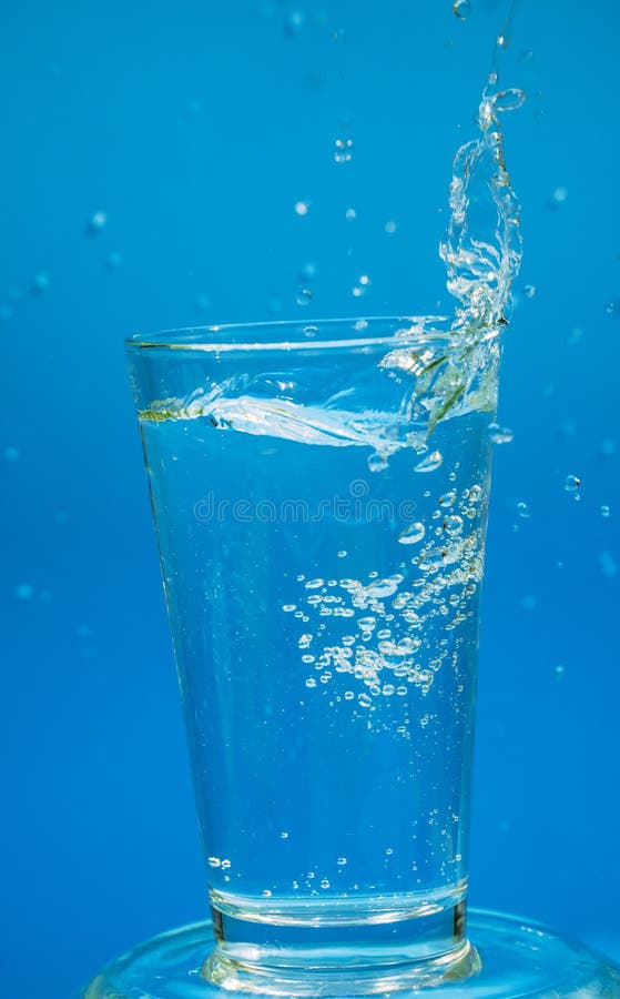 Clear Water is Poured into a Glass Beaker Splashing Around Stock Photo ...