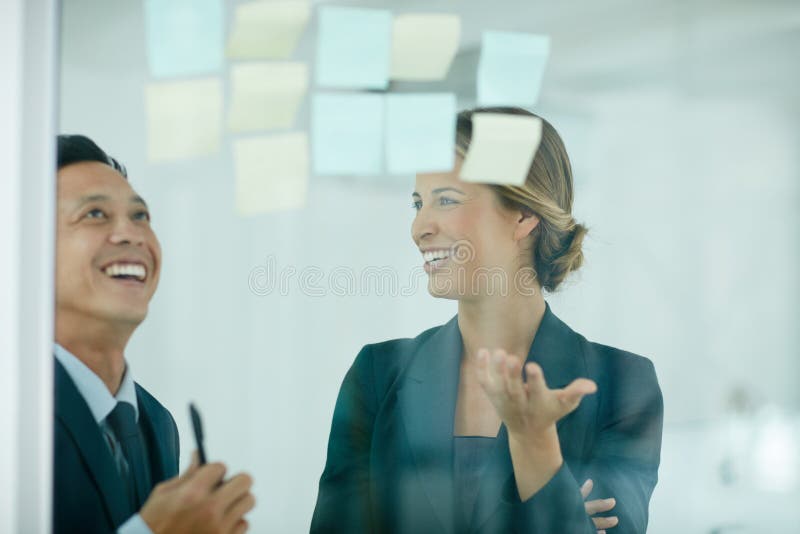 Theyre Highly Driven To Compete and Win. Shot of Coworkers Using Sticky ...