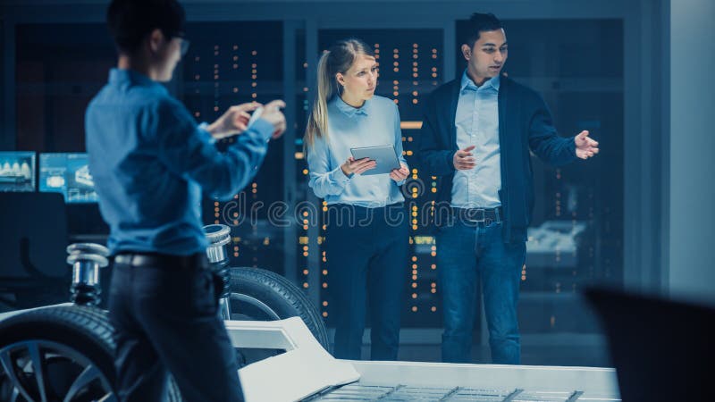Shot of a Development Laboratory Room with Diverse Professional Team of ... Shot of a Development Laboratory Room with Diverse Professional Team of ...