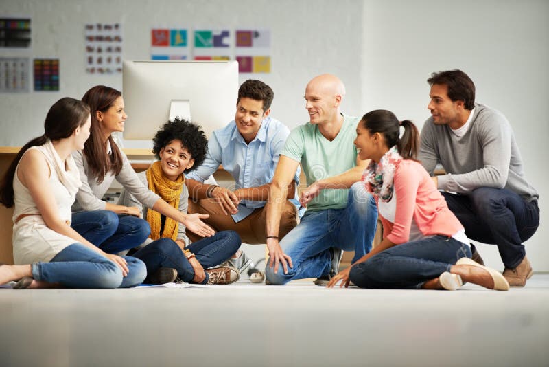 All in a Days Work. Shot of a Diverse Group of Colleagues in an Office ...