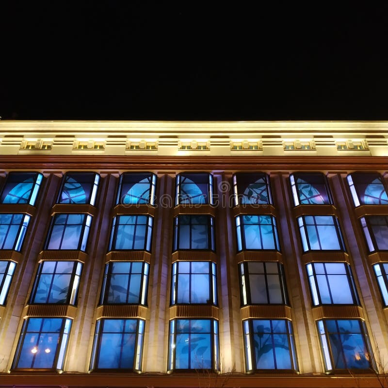 Facade of a Building in Night Stock Photo - Image of windows, town ...