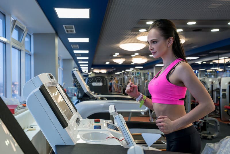 Shot of Focused Girl Running on Treadmill in Gym Stock Image - Image of ...
