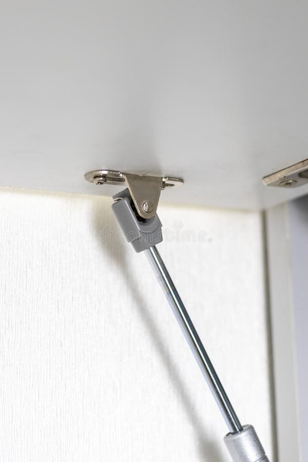 Shot of the Gas Strut for Kitchen Cabinet. Household Stock Image ...