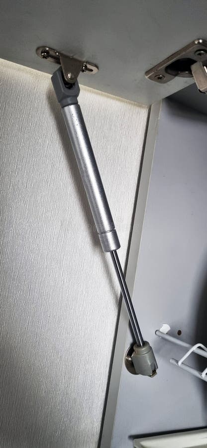 Shot of the Gas Strut for Kitchen Cabinet. Interior Stock Photo - Image ...