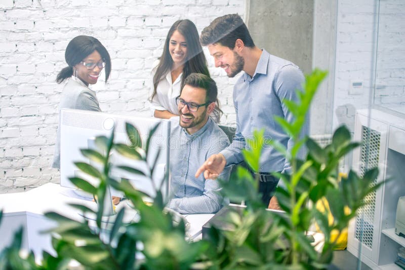 Shot through Glass Wall Multi-ethnic Group of People Working Together ...