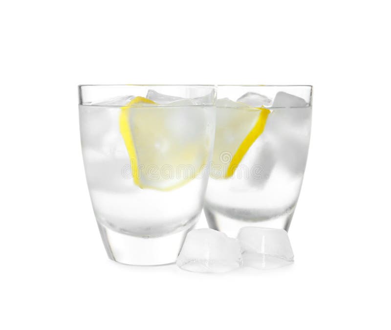 Shot Glasses of Vodka with Lemon Slices and Ice on White Background ...