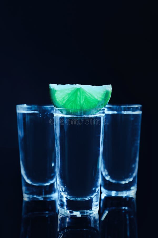 Shot Glasses of Vodka with Lime Slice and Ice on White Background Stock ...