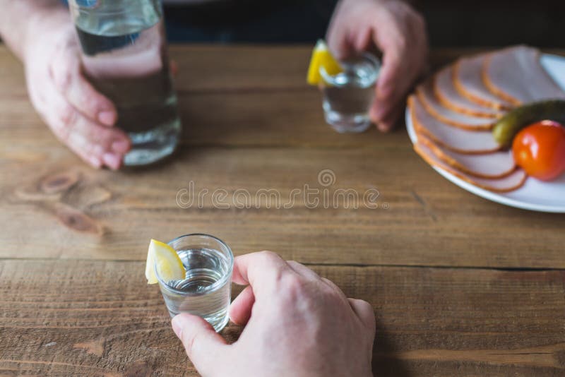 Shot Glasses of Vodka on a Wooden Table Stock Image - Image of glass ...
