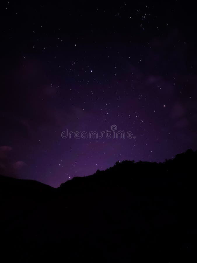 Shot of Glowing Stars and a Mountain of Sky in the Night Stock Photo ...