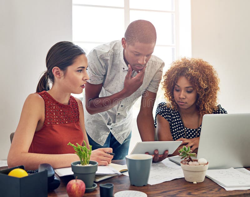 Theyre Problem Solving Specialists. Shot of a Group of Colleagues ...