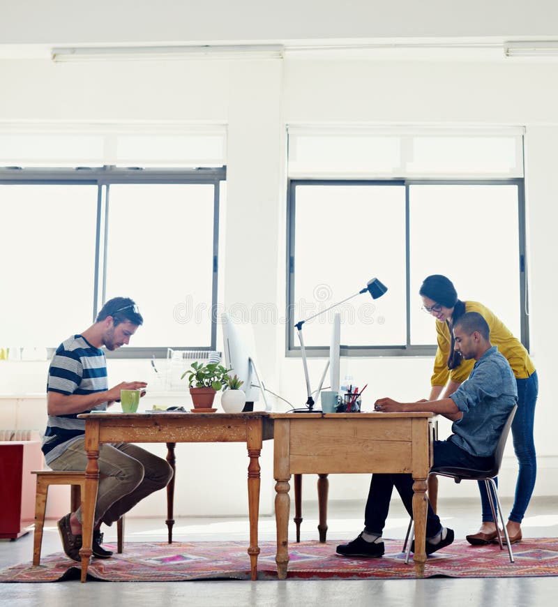 Teamwork and Creativity. Shot of a Group of Creative Professionals ...