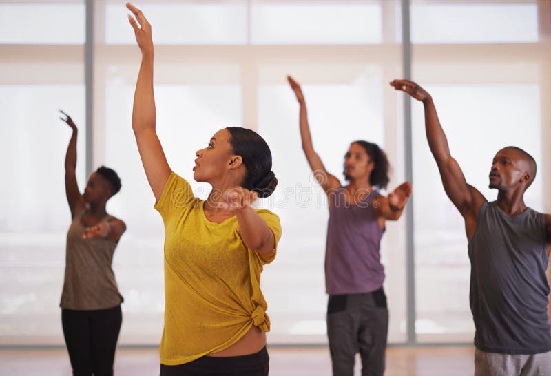 Friends and Dance Partners. Shot of a Group of People Practicing in a ...
