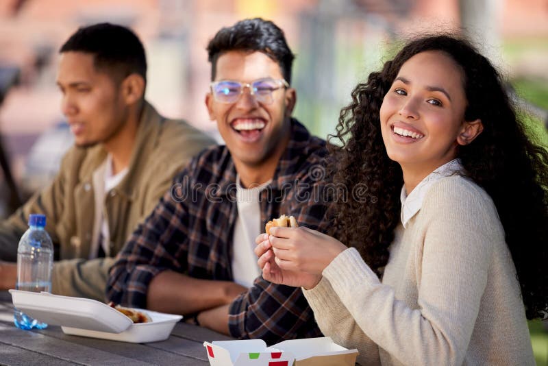 Its Chow Time. Shot of a Group of Students Having a Quick Bite while ...