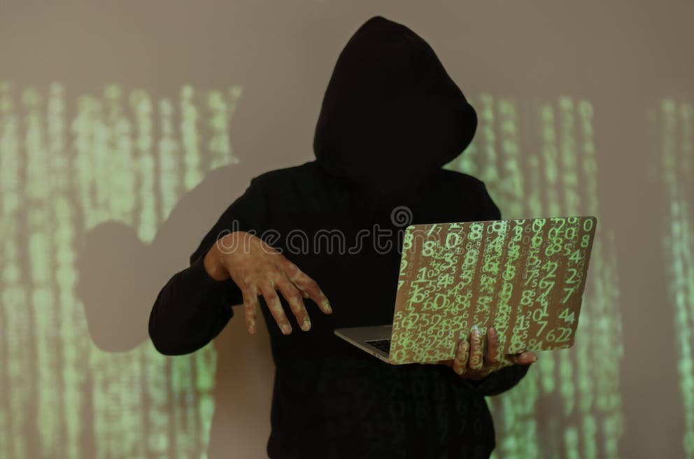 Shot of Hacker Using Laptop. Lots of Digits on the Computer Screen ...