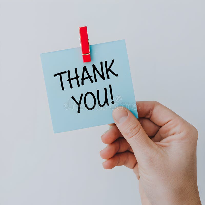 Hand Holds THANK YOU! Note Secured with Red Clothespin on White ...