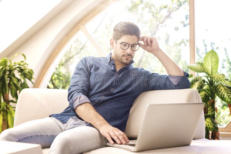 Businessman Using Laptop while Working from Home Stock Photo - Image of ...