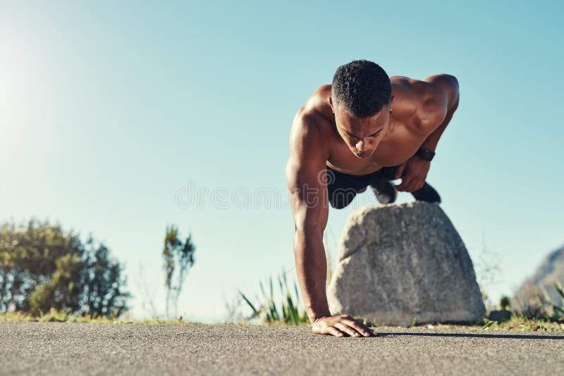 Adding Some Difficulty To My Push Up Routine Today. Shot of a Handsome ...
