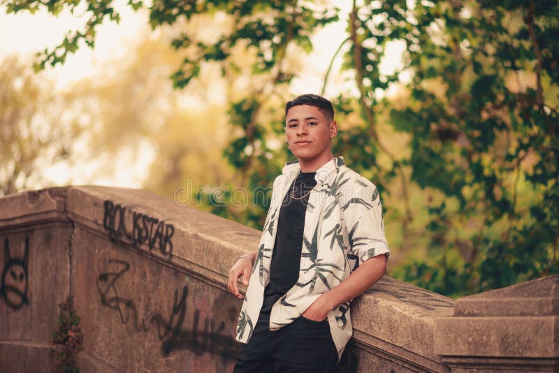 Shot of a Handsome Young Man Standing in a Playground Stock Image ...