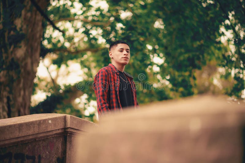 Shot of a Handsome Young Man Standing in a Playground Stock Image ...