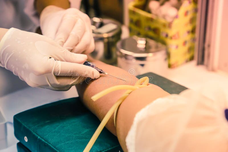 Shot of Human Hands Making an Injection with a Syringe Stock Photo ...