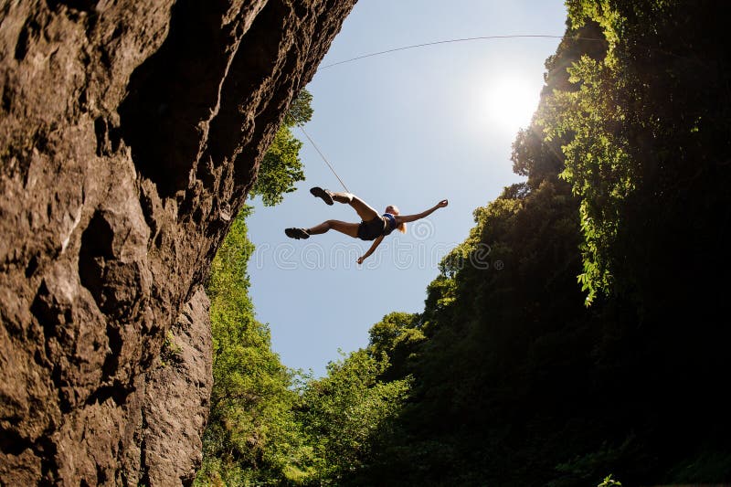 Shot of the Jumping Female Climber from Below Stock Image - Image of ...