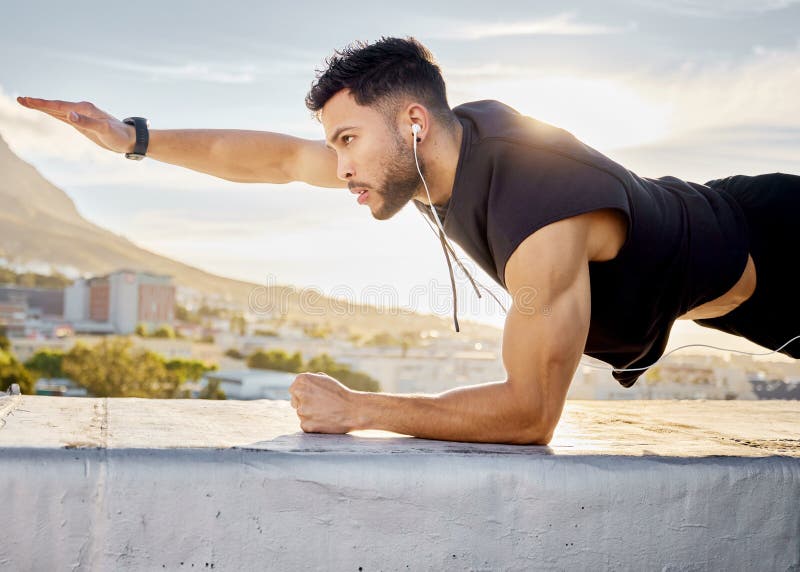 Just Keep Pushing Forward. Shot of a Man Doing a Single-arm Plank while ...