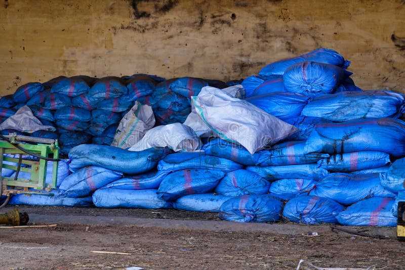 Shot of Many Blue Sacks Near a Wall Stock Photo - Image of bags ...