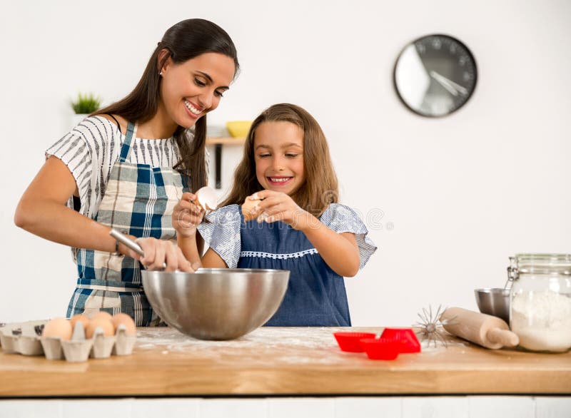 Learning to bake stock image. Image of daughter, domestic - 105348303
