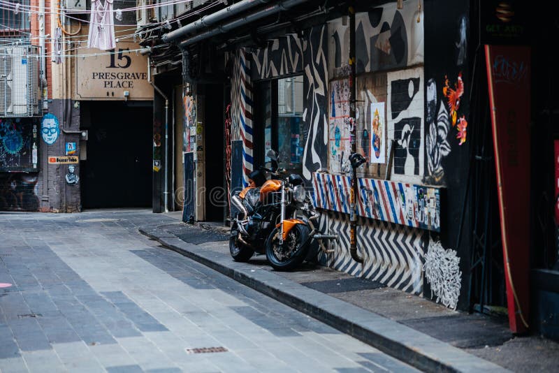 Shot of a Motorcycle Parked by a Street-side Graffiti Wall in Melbourne ...