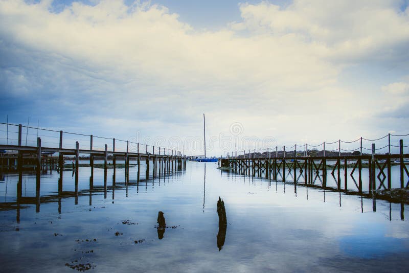 Shot of an Ocean Shore with Bridges on the Sides Stock Image - Image of ...