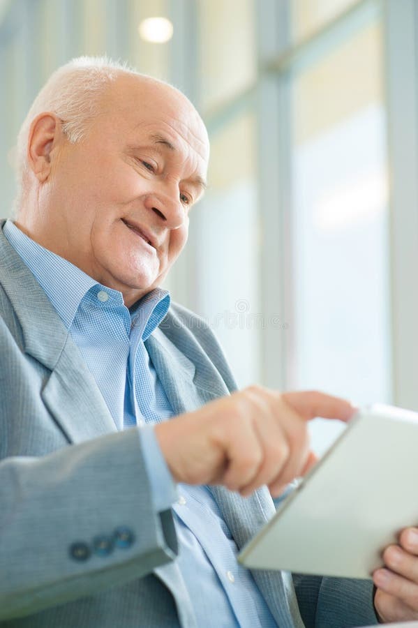 Shot of Old Man Using Digital Tablet. Stock Image - Image of mindful ...