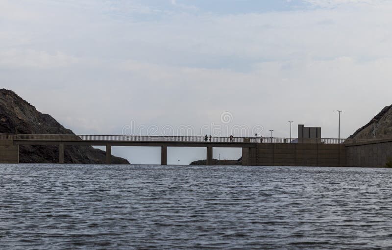 Shot of a People Crossing the Bridge Above the Water. Outdoors Stock ...