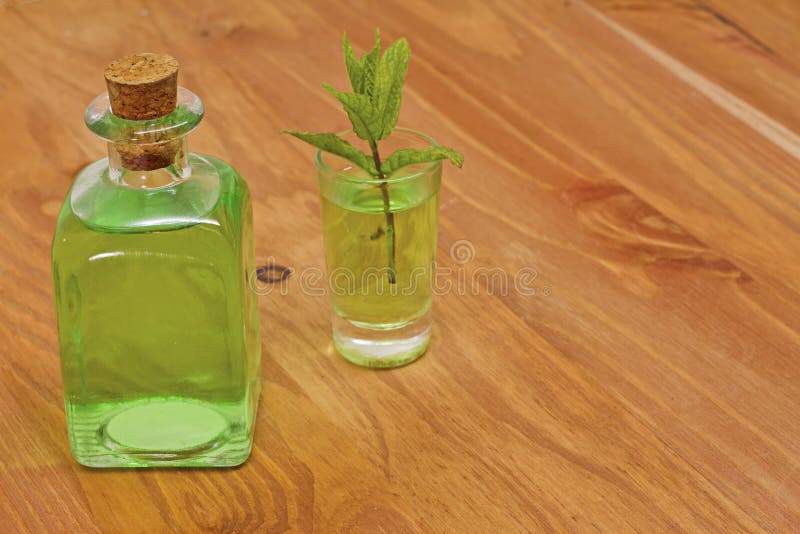 Shot and Peppermint Liqueur Bottle Stock Image - Image of wooden, drink ...