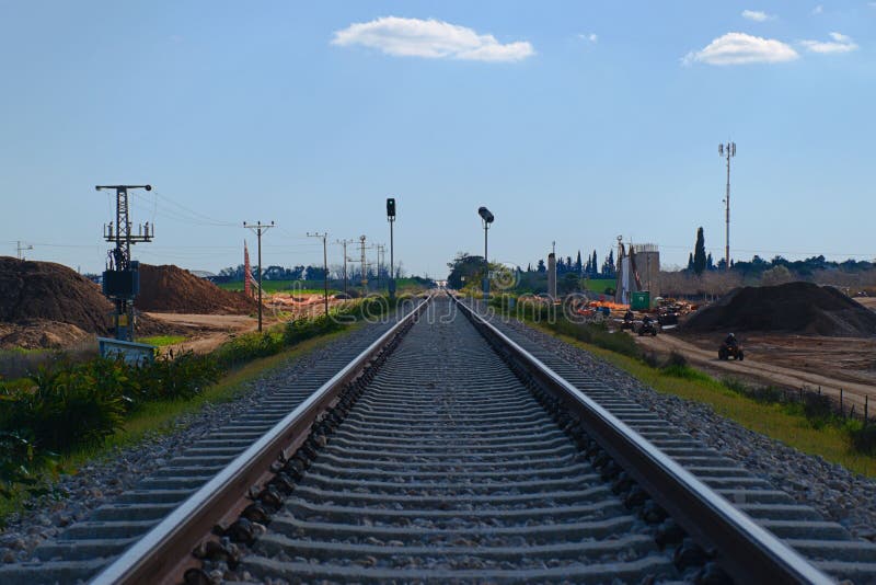 Shot of Railway Tracks with a Construction Site in the Background Stock ...
