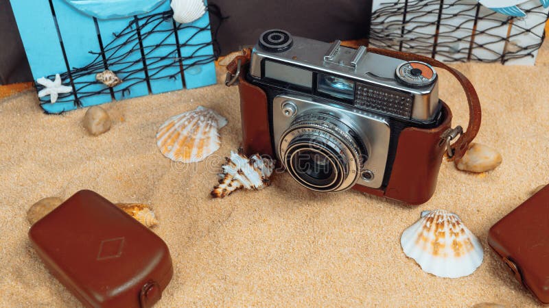 Retro Camera on the Sand between Seashells Against the Backdrop of ...