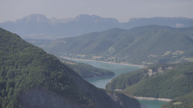 Shot of a River Passing between Two Hills Covered with Trees. Stock ...