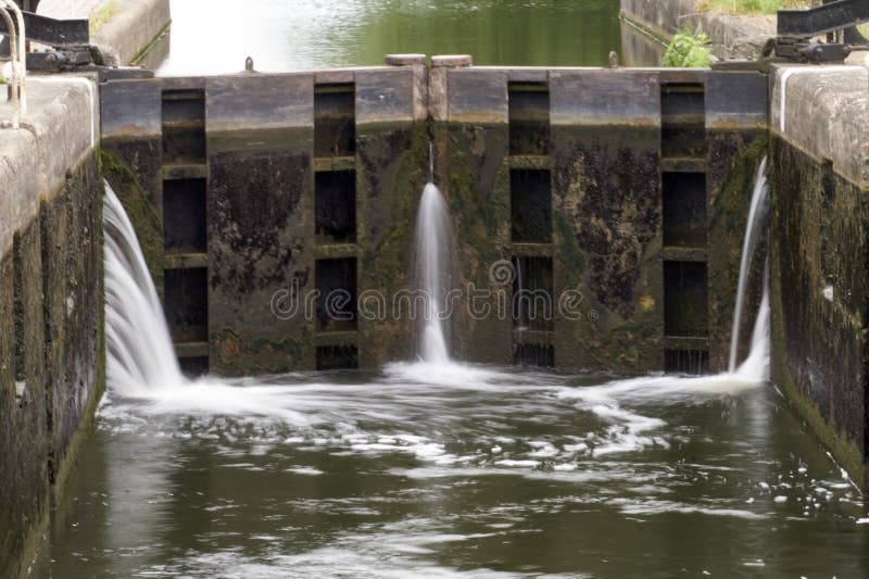 Shot of the River Water Spilling Out through a Metal Wall Stock Image ...